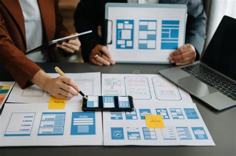 Ux Developer And Ui Designer Brainstorming About Mobile App Interface