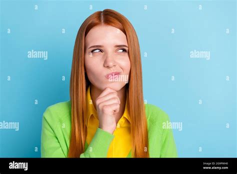 Photo Of Unsure Young Lady Look Empty Space Think Wear Yellow Sweater