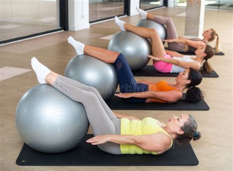 Four Women Doing Crunches With Swiss Balls Stock Image Image Of