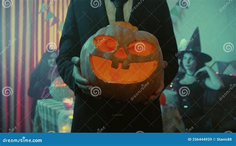 Close Up Of An Unrecognizable Guy Holding A Jack O Lantern For