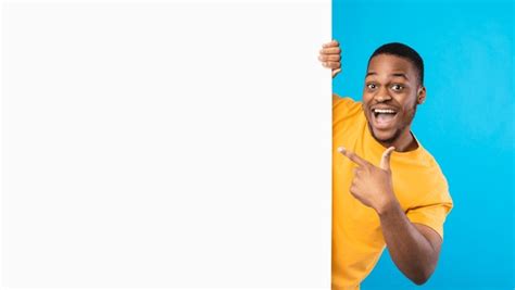 55 African Man Pointing Finger At Copy Space On Paper Poster Images