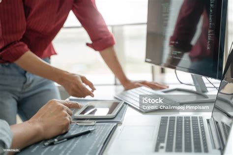 Development Programmer Writing A Code On Database Teamwork Cooperation