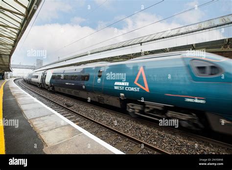 Avanti 390 Pendolino Speeding Through Penrith North Lakes Station With Motion Blur Cumbria
