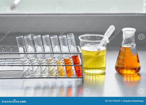 Test Tubes And Orange Liquid In Flask In Science Laboratory Stock Image Image Of Funnel