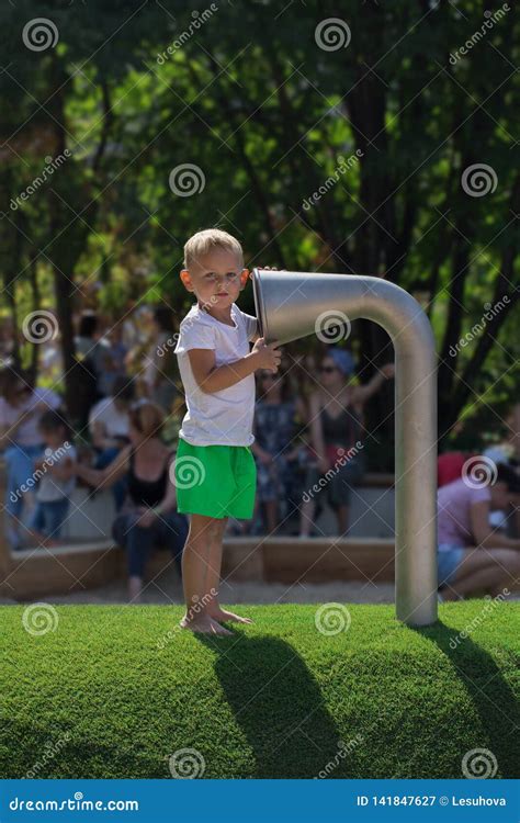A Little Boy And A Metal Pipe Stock Image Image Of Cheerful Green