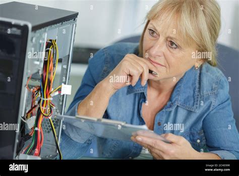 Woman Checking The State Of A Pc Stock Photo Alamy
