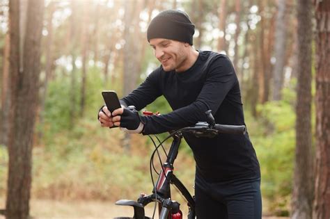 Premium Photo Funny Smiling Sportsman Wearing Black Sport Clothes