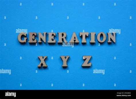 Generation X Y Z Word In Wooden Alphabet Letters Isolated On Blue