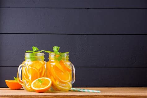 Premium Photo Infused Water With Orange Fruit Lemon And Mint Iced