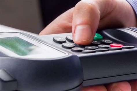 Premium Photo Man Entering His Pin On Terminal