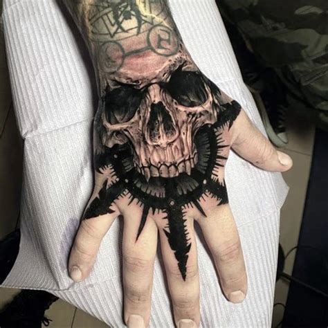 Skull Hand Tattoos For Men