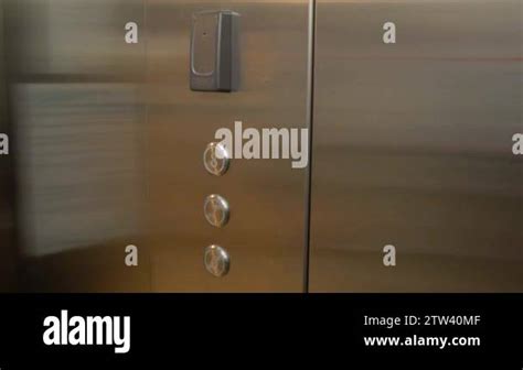 Man Enters The Elevator Then Attach His Plastic Key Card In Elevator