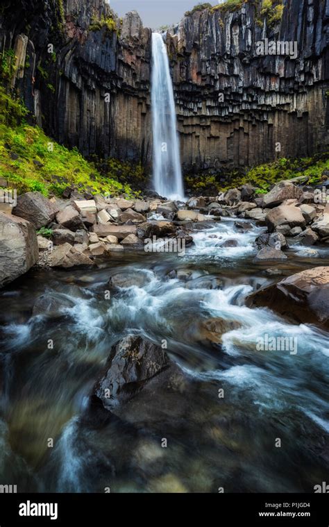 Svartifoss Waterfall In Autumn With Watercourse In Long Exposure