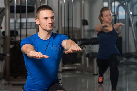 People Stretching During Fitness Class In Fitness Center Stock Image