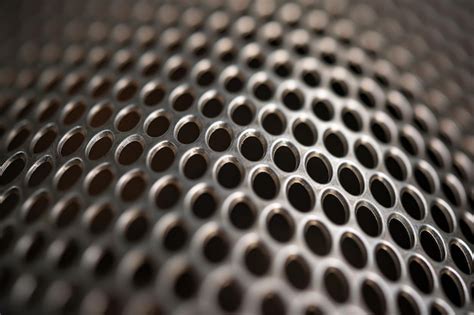 Premium Photo Intricate Patterns Of Perforated Metal Unveiling A