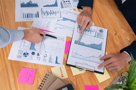 Analyst Team In Office Analyzing Financial Data Analysis Papers Entity