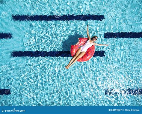 Woman Relaxing With Lilo In Pool Stock Image 84199837