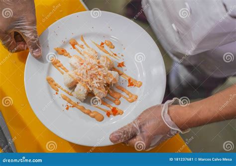 Hands In Gloves Of Asian Professional Chef Preparing Delicious And