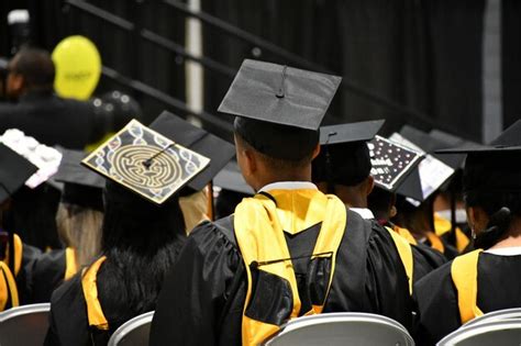 Premium Photo A Group Of People Are Wearing Graduation Caps And Gowns