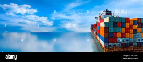 Stern Of Large Cargo Ship Import Export Container Box On The Ocean Sea On Blue Sky Back Ground
