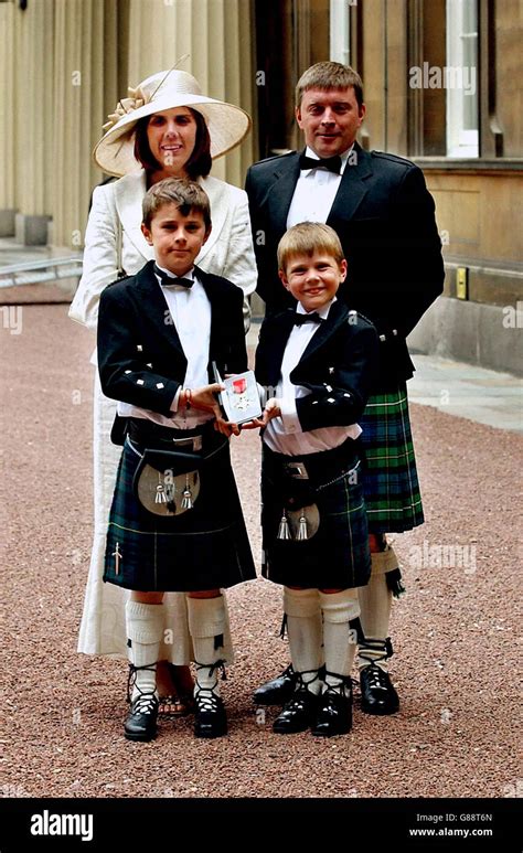 Dr Michael Cambell Mccafferty Stands With His Wife Anna As His Sons Sean Left 10 And Kevin