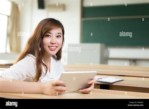 Asian Beautiful Woman Using Tablet In Classroom Stock Photo Alamy