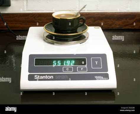 Showing Conservation Of Mass Weighing The Cup Of Coffee With Sugar And