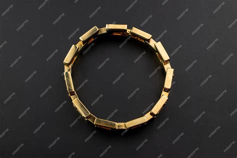 Premium Photo Gold Bracelet On A Black Background View From Above
