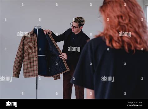 Tailor Showing The Suit He Made Fashion Designer Showing An