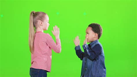 Cheerful Girl And Cute Boy Clapping Hands Together In Motion Stock