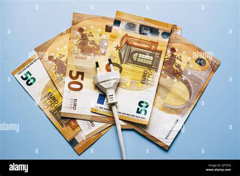 Electric Plug Lies On Euro Banknotes Showing The Drastical Inflation On