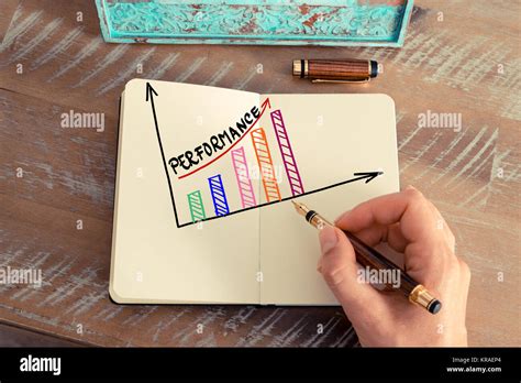 Business Woman Drawing A Colourful PERFORMANCE Graph Stock Photo Alamy
