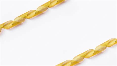 휴일 배경에서 빛나는 골드 리본 무료 사진