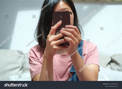Hiding Phone Over 4 341 Royalty Free Licensable Stock Photos