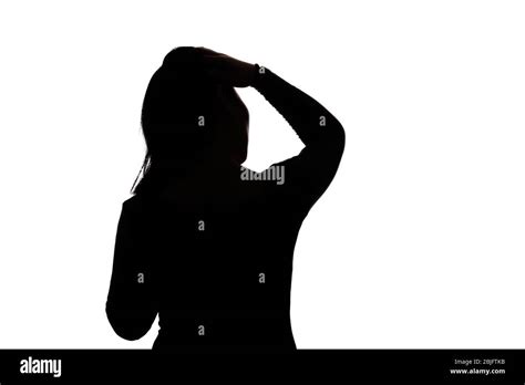 Black Backlit Silhouette Of Head And Shoulders Of An Oriental Woman