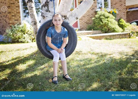 Portrait Of Girl On Tire Swing Stock Image Image Of Park Young