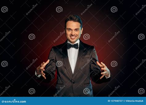 Professional Occupation Showman In Suit Standing Isolated On Wall
