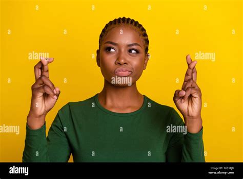 Photo Of Doubtful Unsure Young Lady Dressed Green Shirt Fingers Crossed