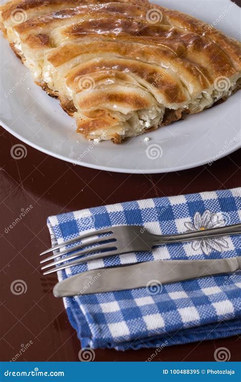 Burek With Cheese On The Plate With Metal Fork And Knife On The Kitchen