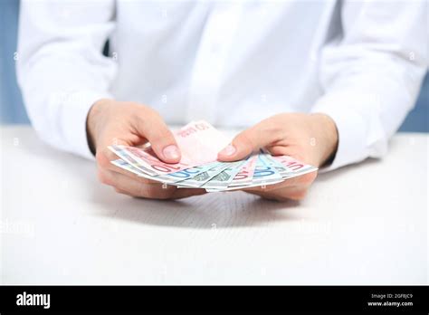 Man Counting Money And Making Calculations Stock Photo Alamy