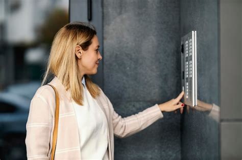 Premium Photo A Fashionable Woman Is Giving Her Fingerprint On Intercom In Front Of The Building