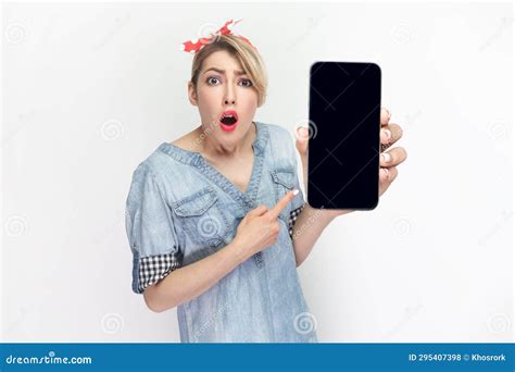 Shocked Astonished Woman Standing Pointing At Big Cell Phone With Empty
