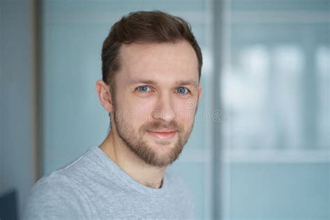 Positive Freelancer Male Portrait Looking Straight At Camera Smiling