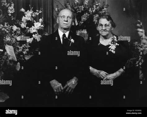 Married Couple Grimily Sit For Their 50th Anniversary Portrait C 1950