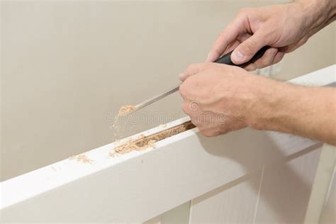 Using Chisel Joiner Cuts Hole For Door Latch Strip Stock Image