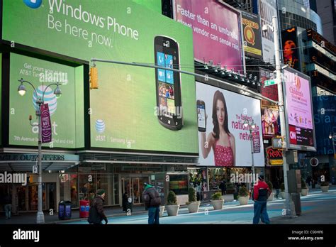 An Advertisement For T Mobile Cell Phones Is Seen Next To An Advertisement For At T Cell Phones