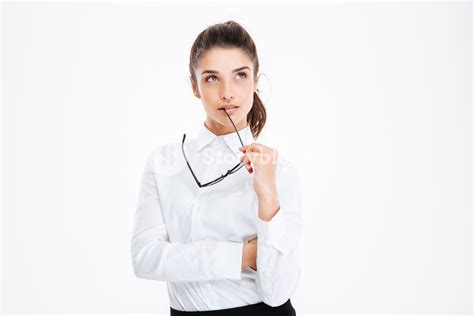 Reflective Young Professional Holding Glasses And Contemplating On