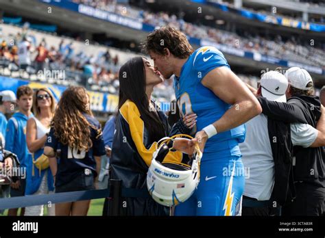Los Angeles Chargers Quarterback Justin Herbert Right Kisses Madison