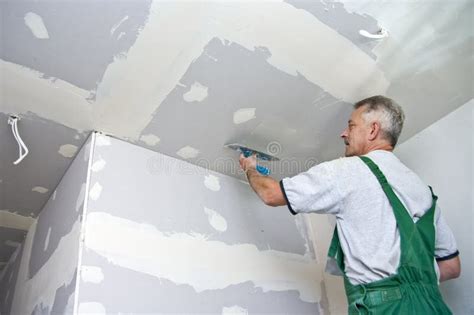 Man Installing Drywall On Ceiling Stock Photo Image Of Work Build