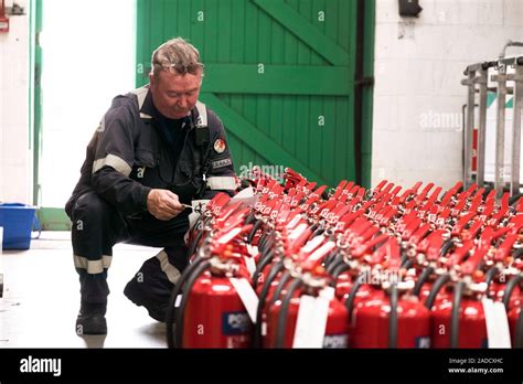 Calachem Chemical Factory Worker Checking New Fire Extinguishers Ready